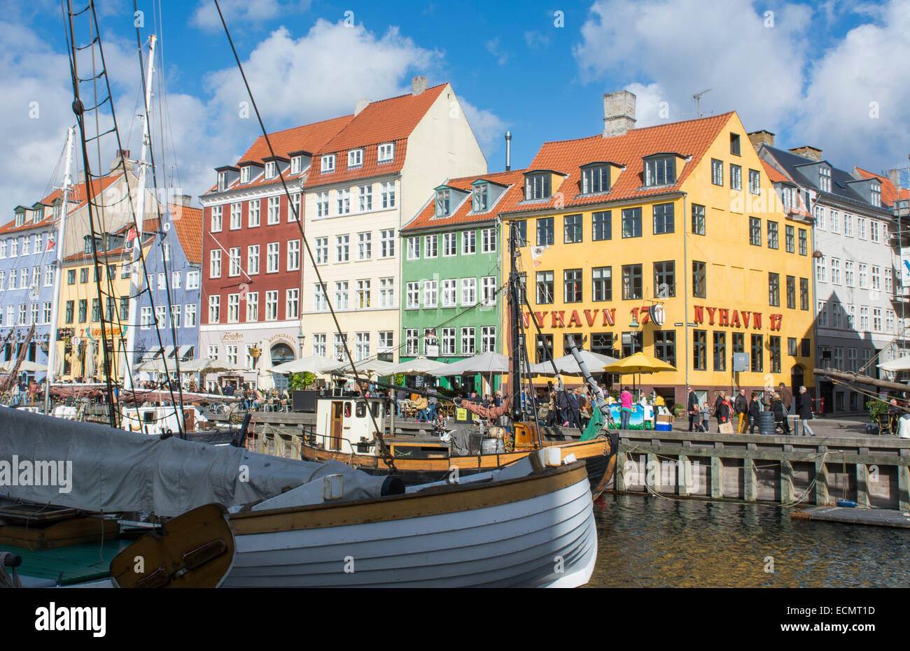 Copenhagen Denmark famous Nyhavn color homes and boats with crowds ...