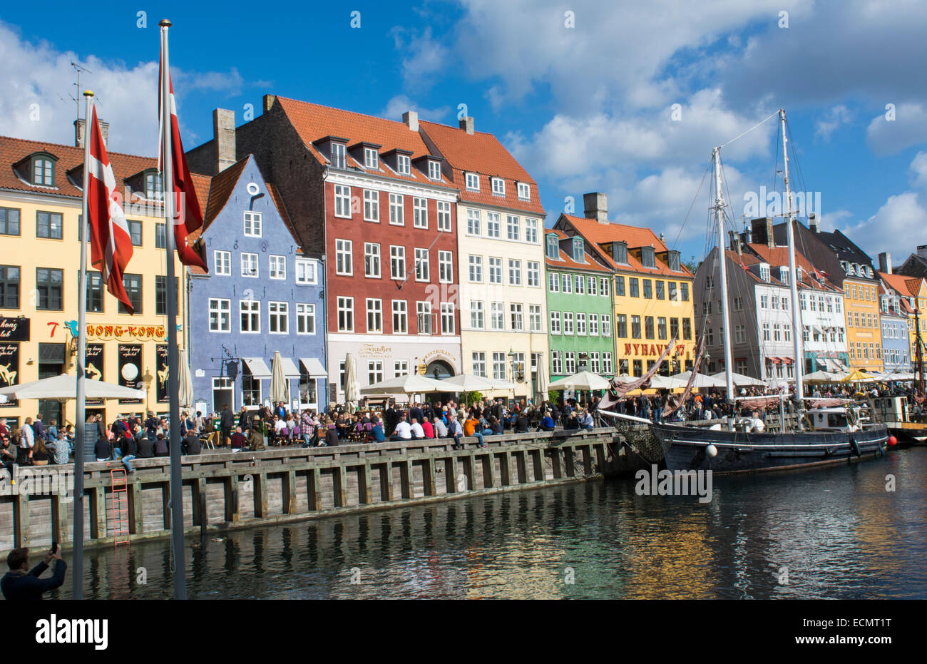 Copenhagen Denmark famous Nyhavn color homes and boats with crowds ...