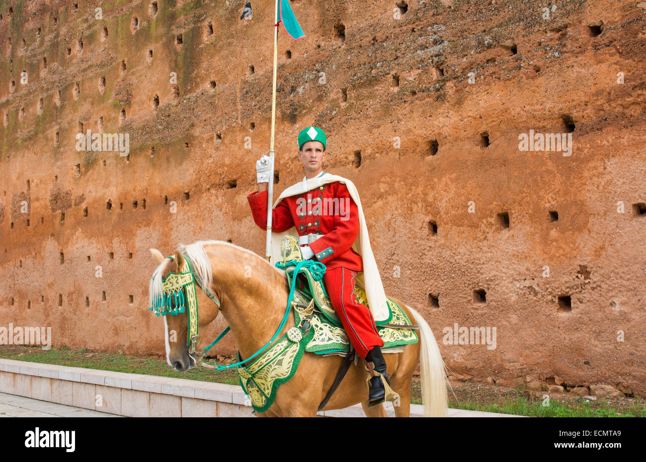 Rabat Morocco guard on horse at Mausoleum of Mohammed V against stone ...
