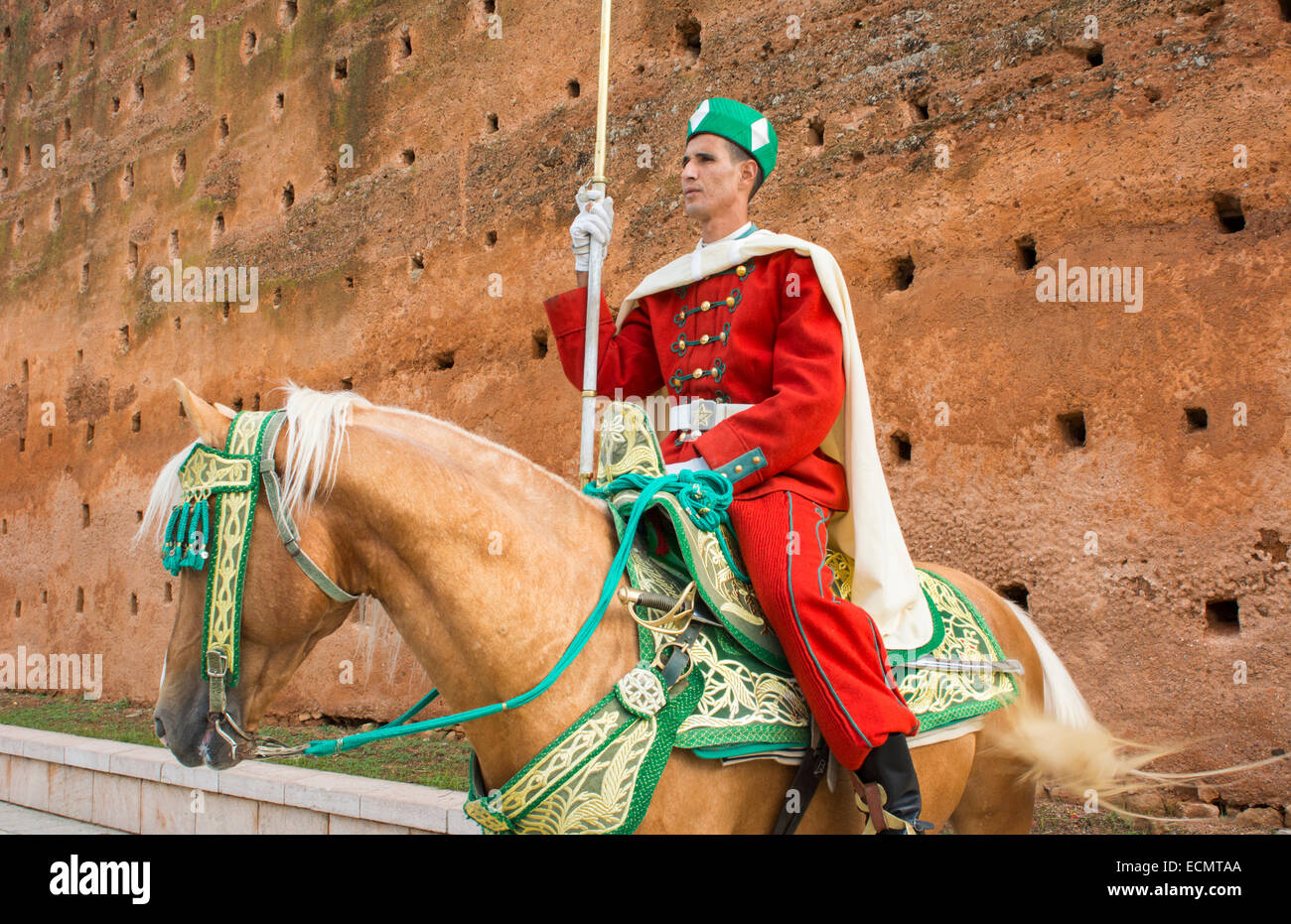 Rabat Morocco guard on horse at Mausoleum of Mohammed V against stone ...