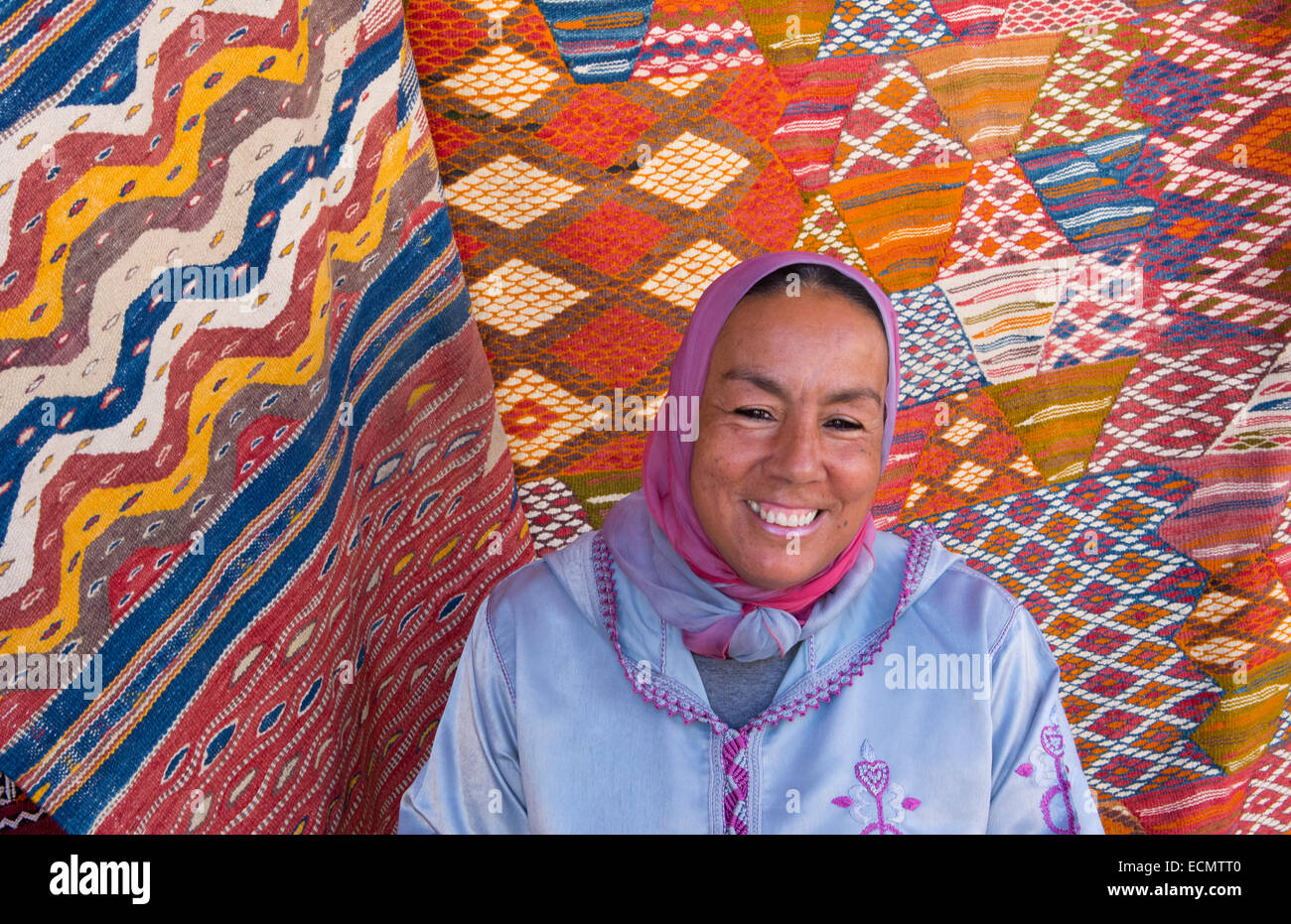Meknes Morocco main square of city medina iocal woman portrait with rug ...