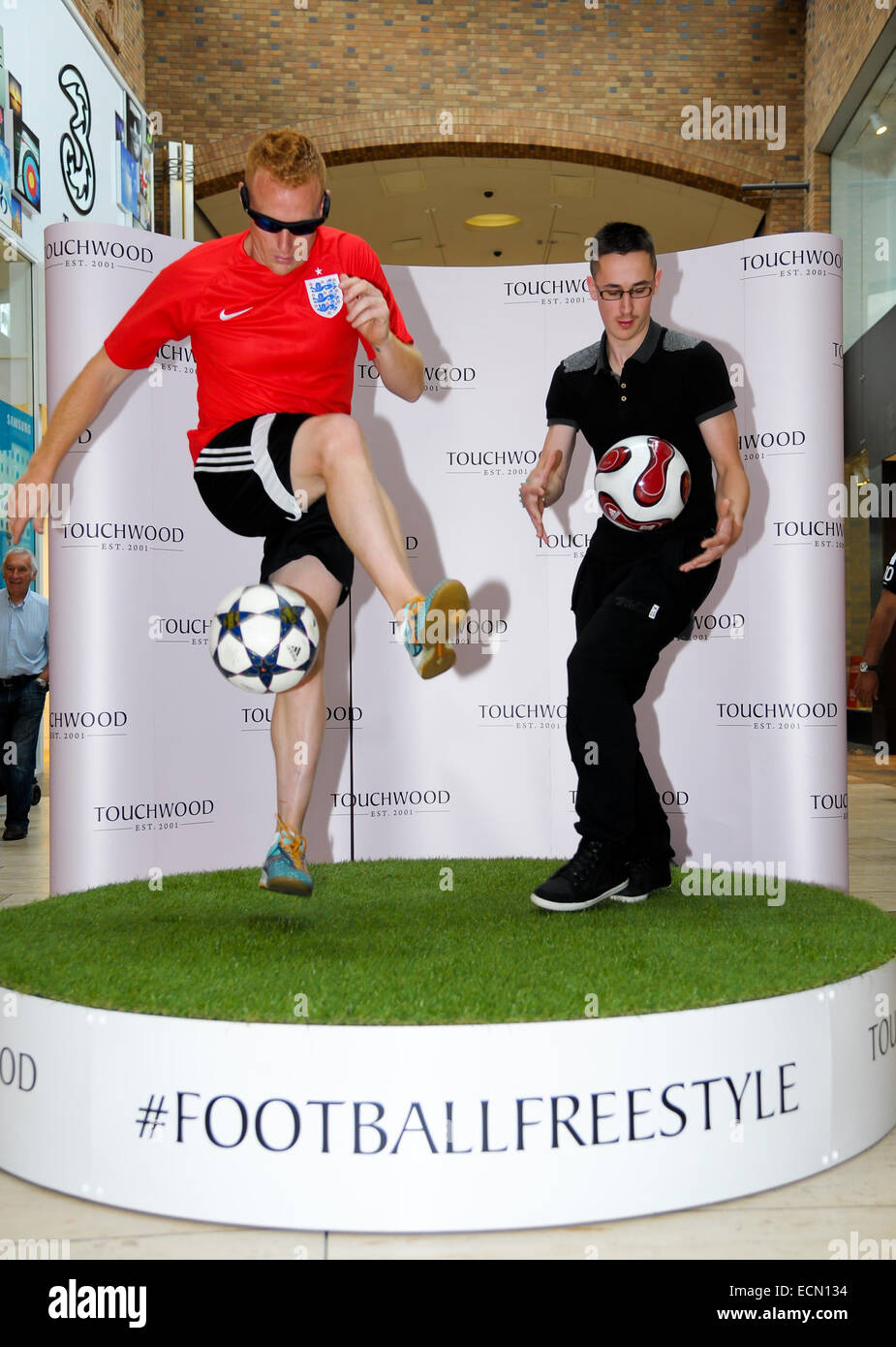 World-record holding football freestyler Dan Magness performs a series ...