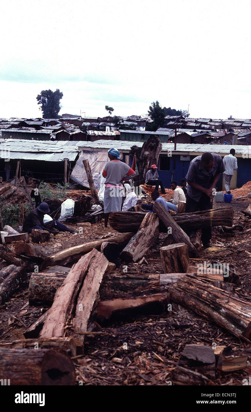 men cutting wood in Nairobi slums circa 1994 Stock Photo - Alamy
