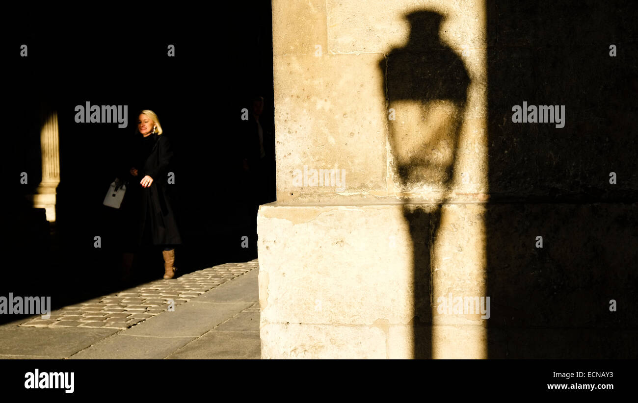 Woman paris shadow street hi-res stock photography and images - Alamy