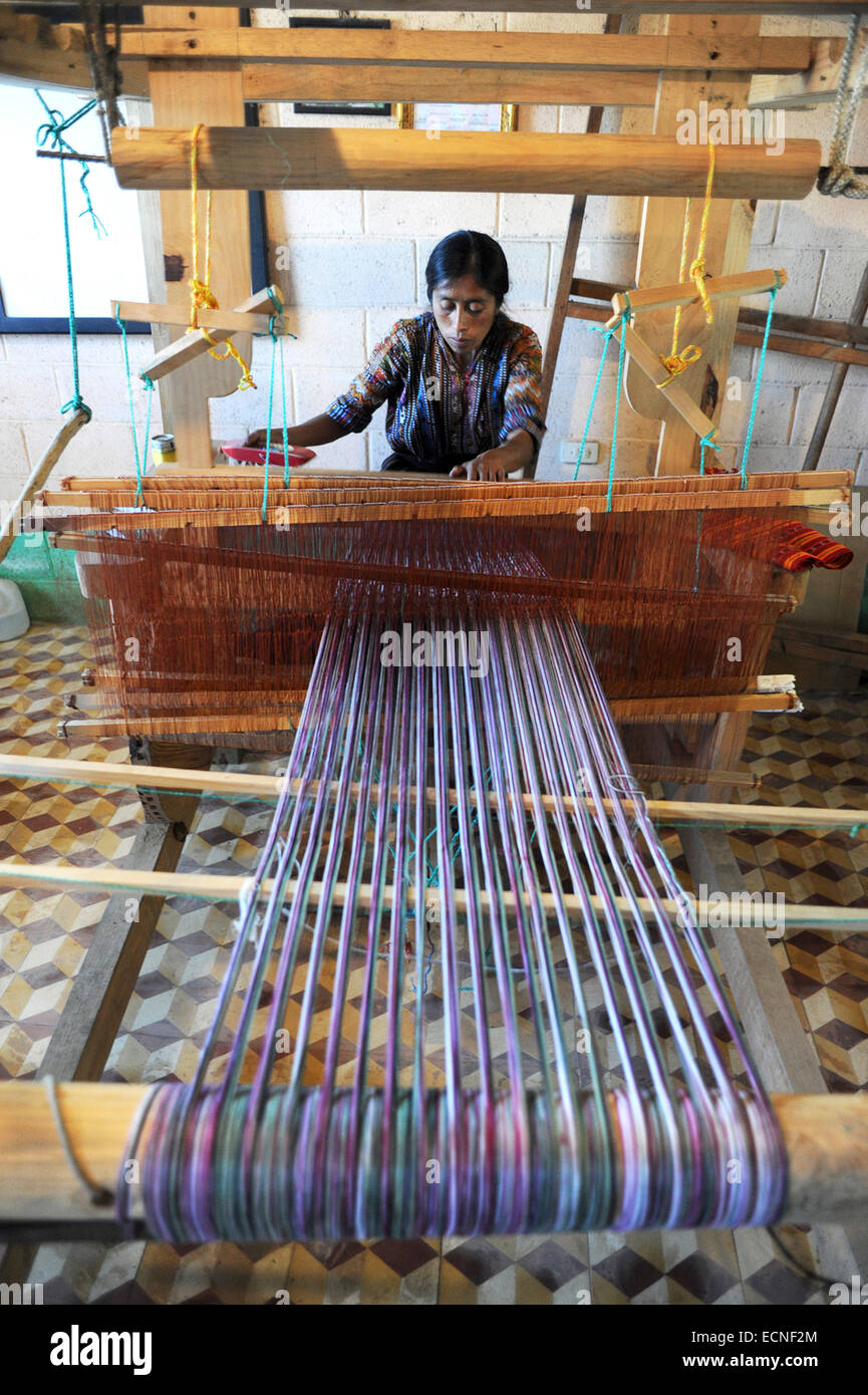 A maya indigenous woman weaves on loom in Churacruz, Solola, Guatemala ...