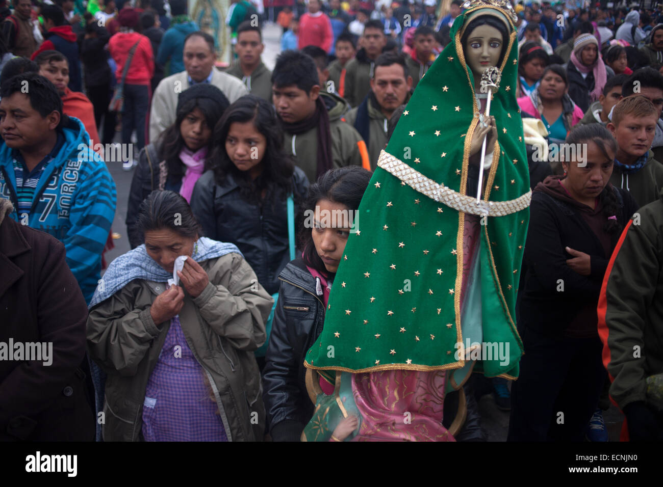 A pilgrim holds a sculpture of the Virgin of Guadalupe. Annual ...