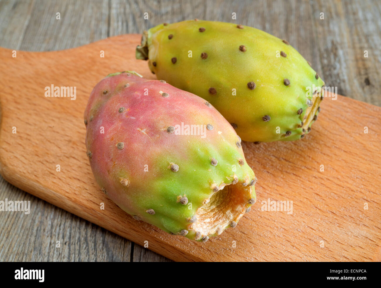 prickly pears and raspberries on cutting board Stock Photo - Alamy
