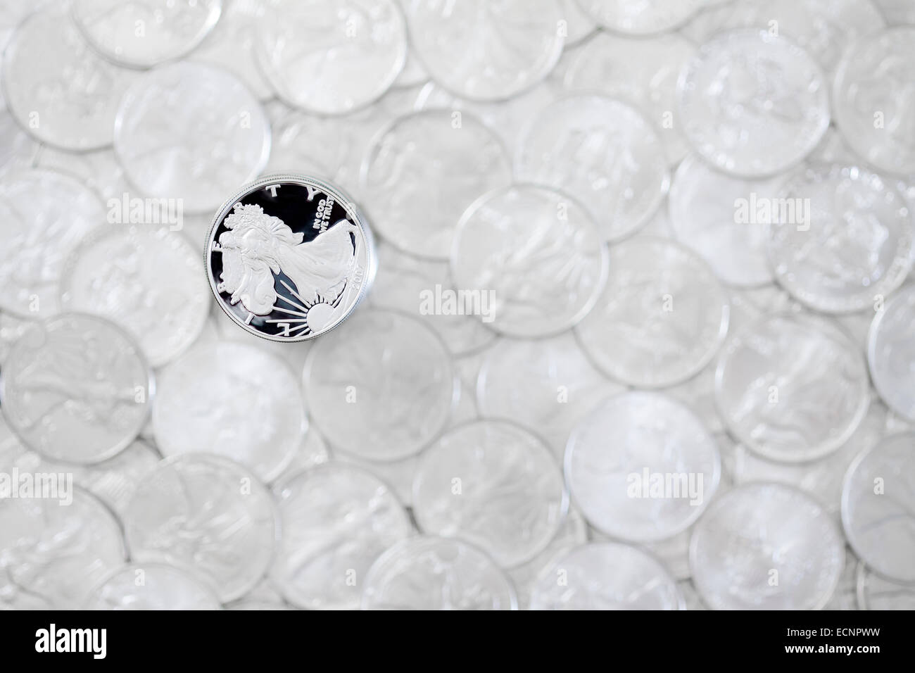 Silver shiny one dollar coin isolated on blurred money background Stock ...
