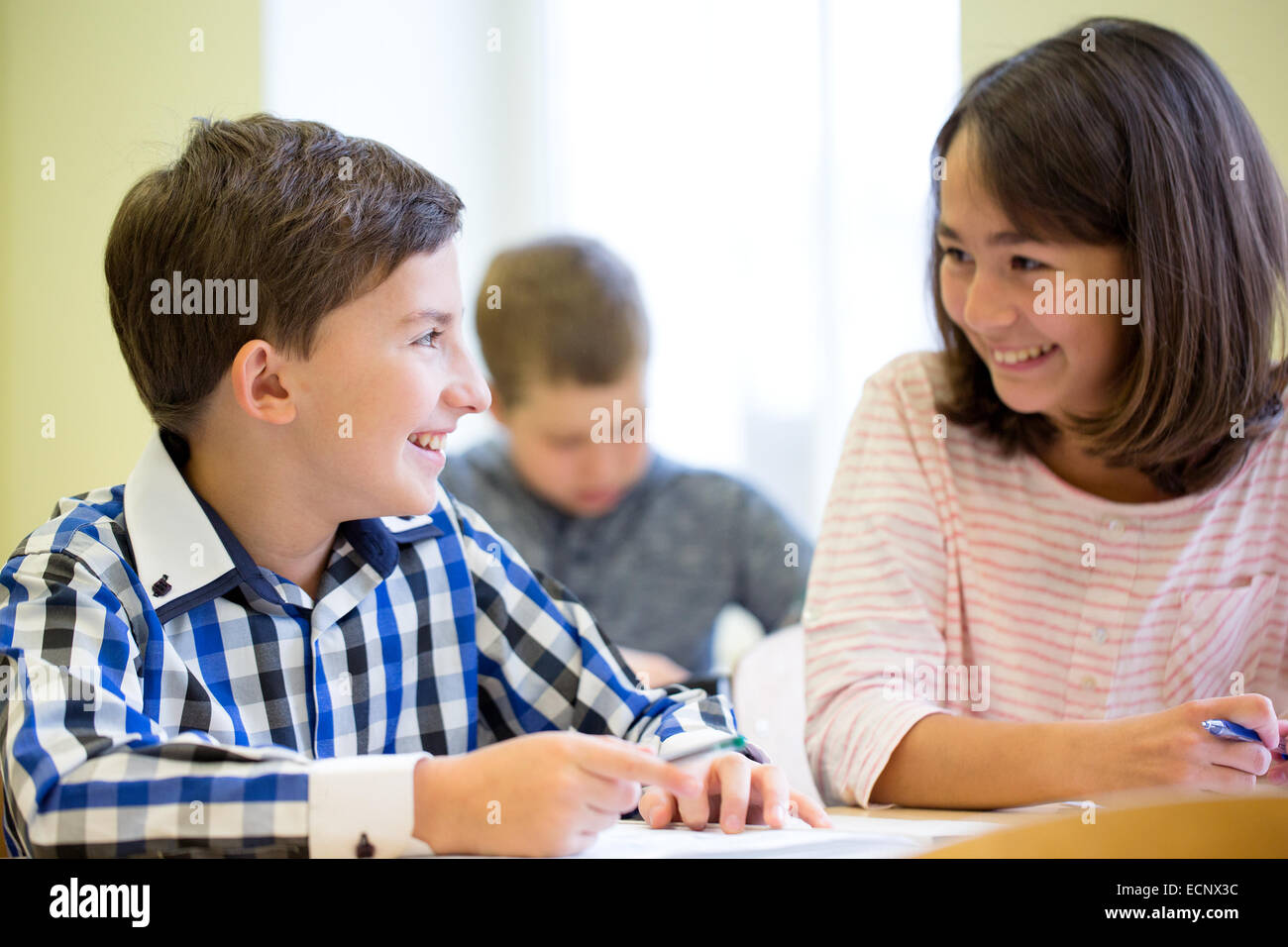Multiethnic students writing test hi-res stock photography and images ...
