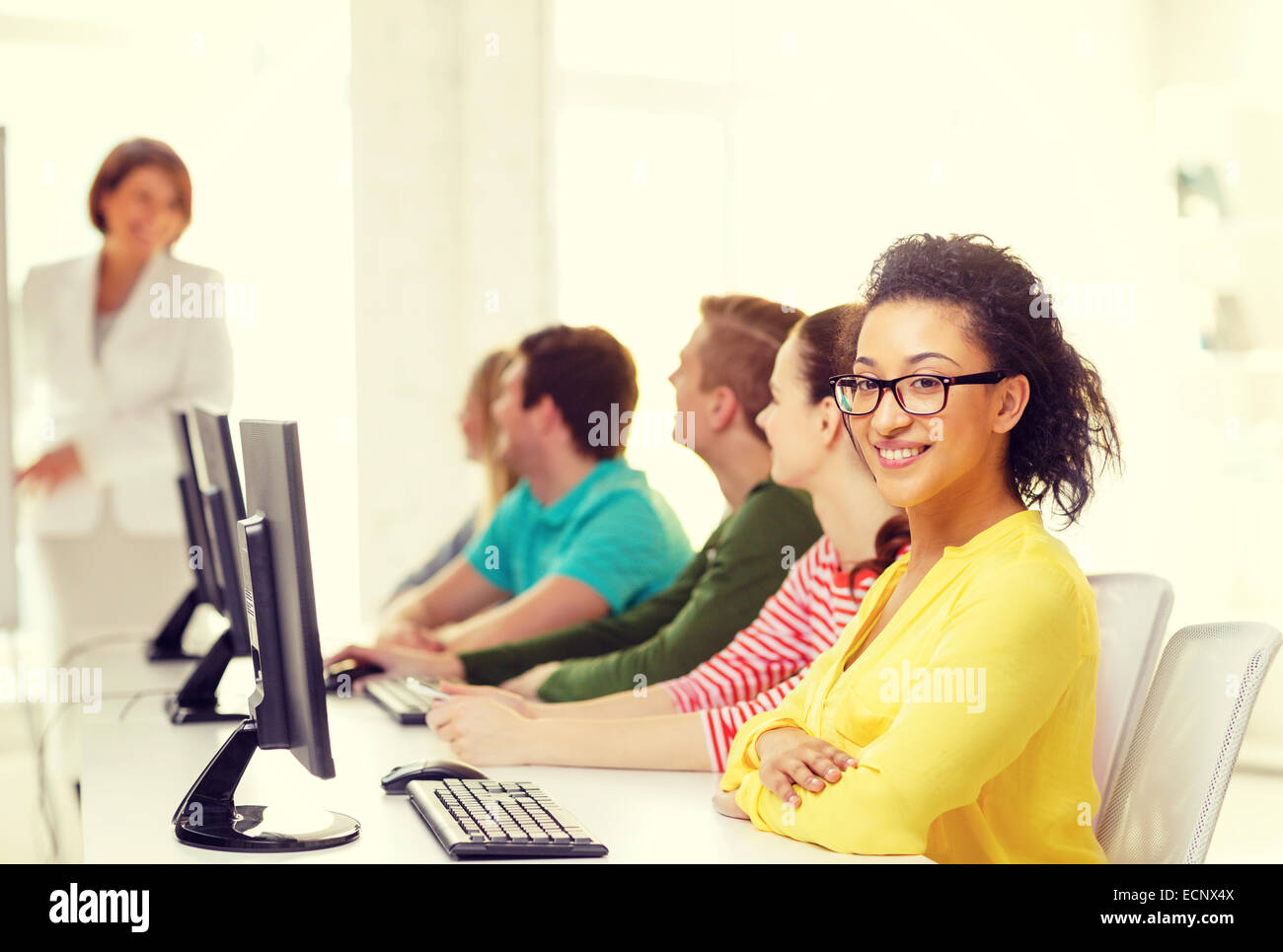female student with classmates in computer class Stock Photo - Alamy