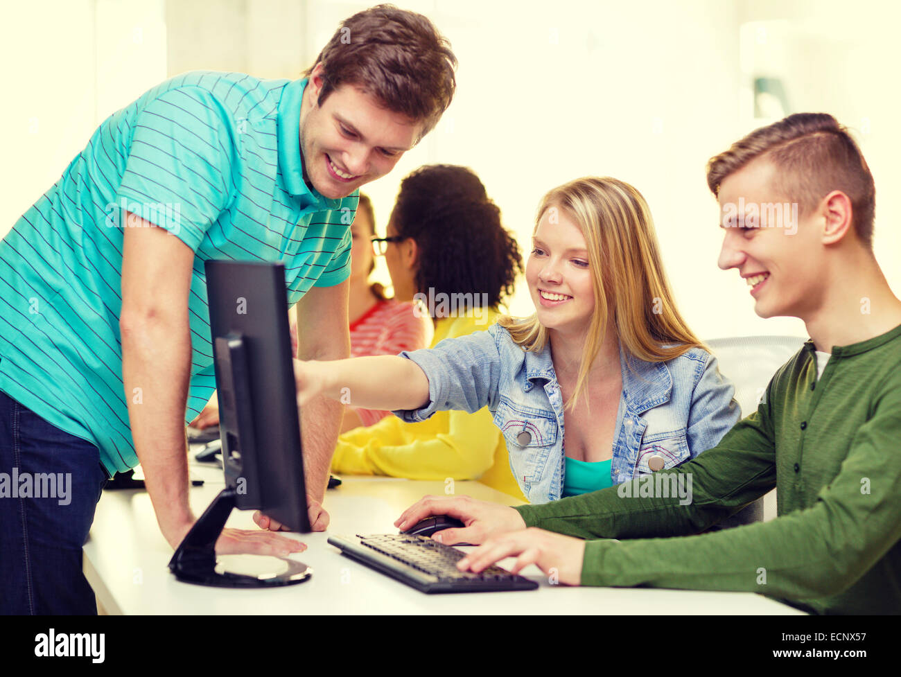 smiling students in computer class at school Stock Photo - Alamy