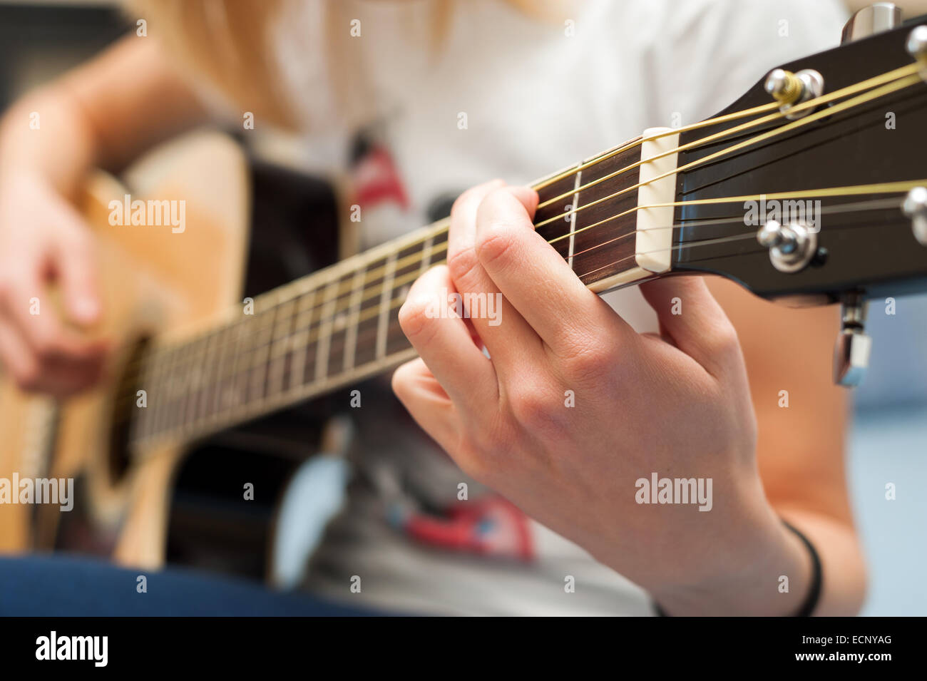 Playing acoustic guitar Stock Photo - Alamy