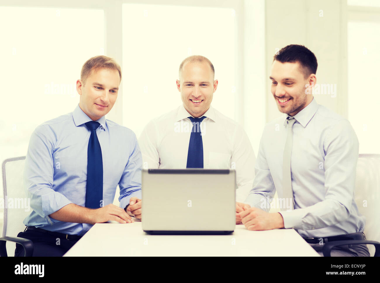 business team working with laptop in office Stock Photo - Alamy