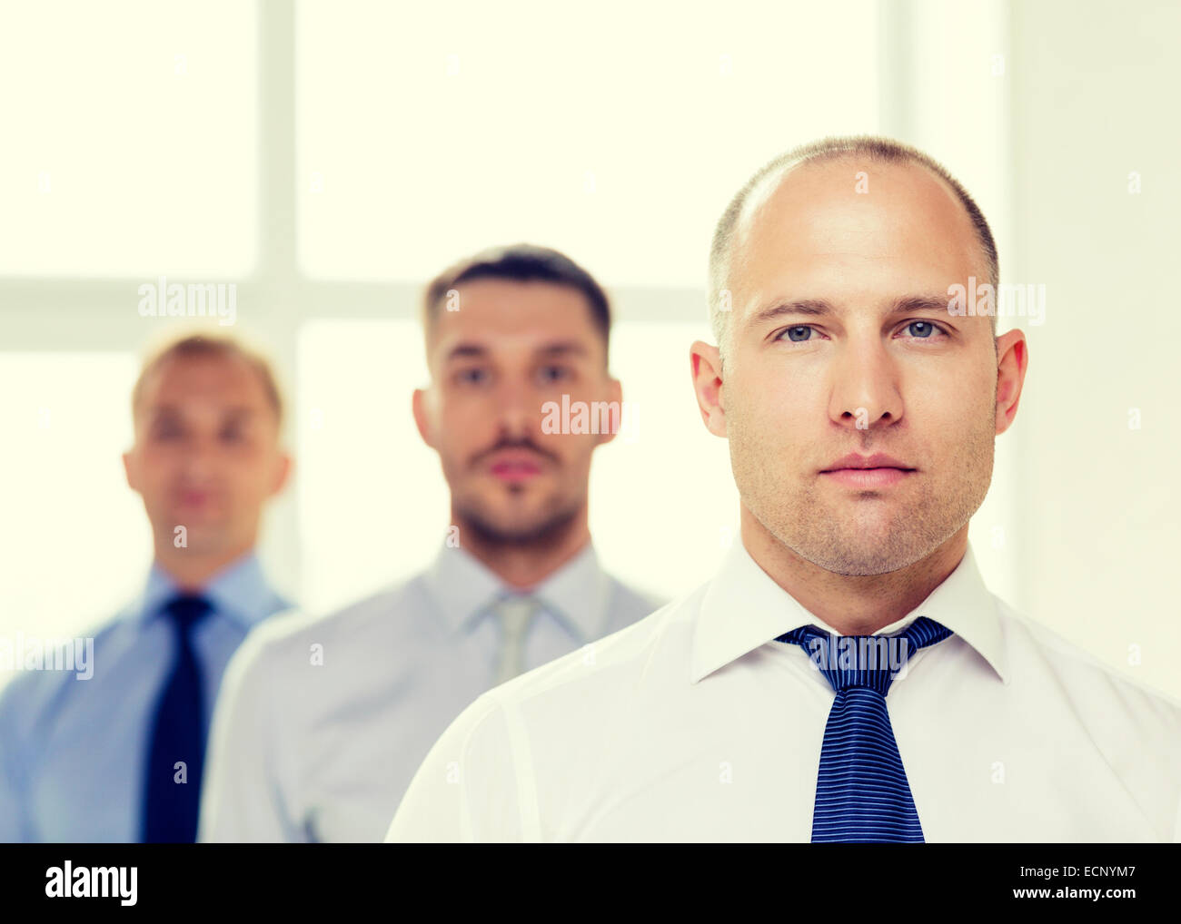Serious businessman brainstorming colleagues hi-res stock photography ...