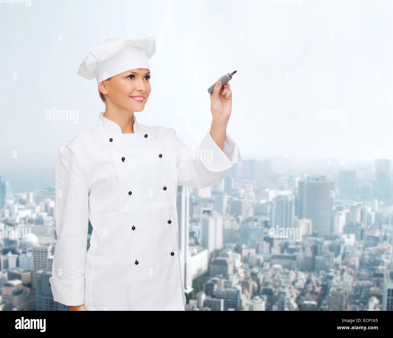 smiling female chef writing something on air Stock Photo - Alamy
