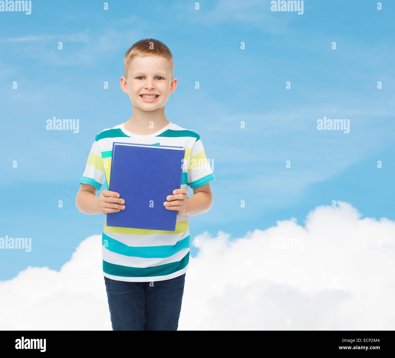 smiling little student boy with blue book Stock Photo - Alamy