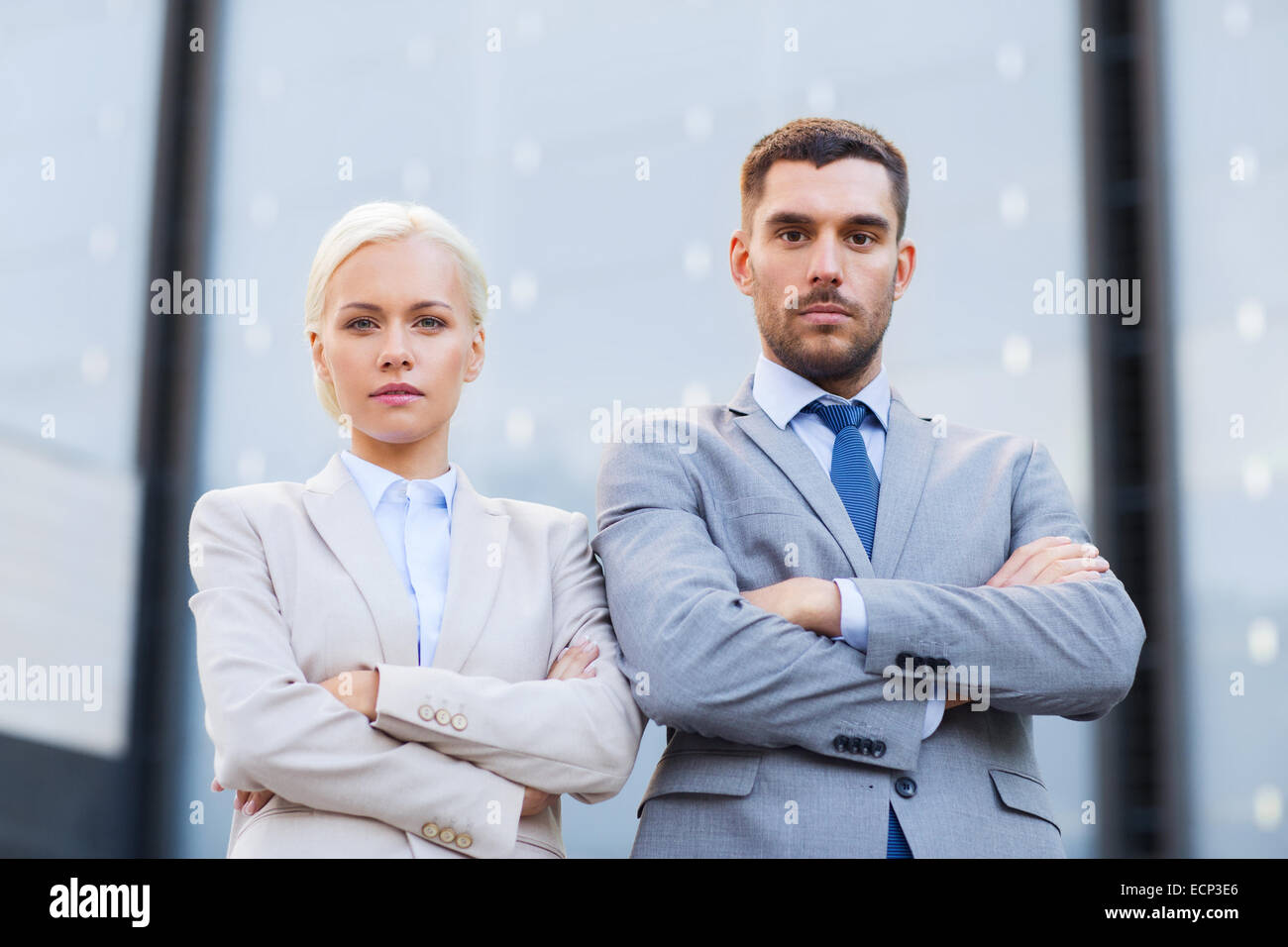 serious businessmen standing over office building Stock Photo - Alamy