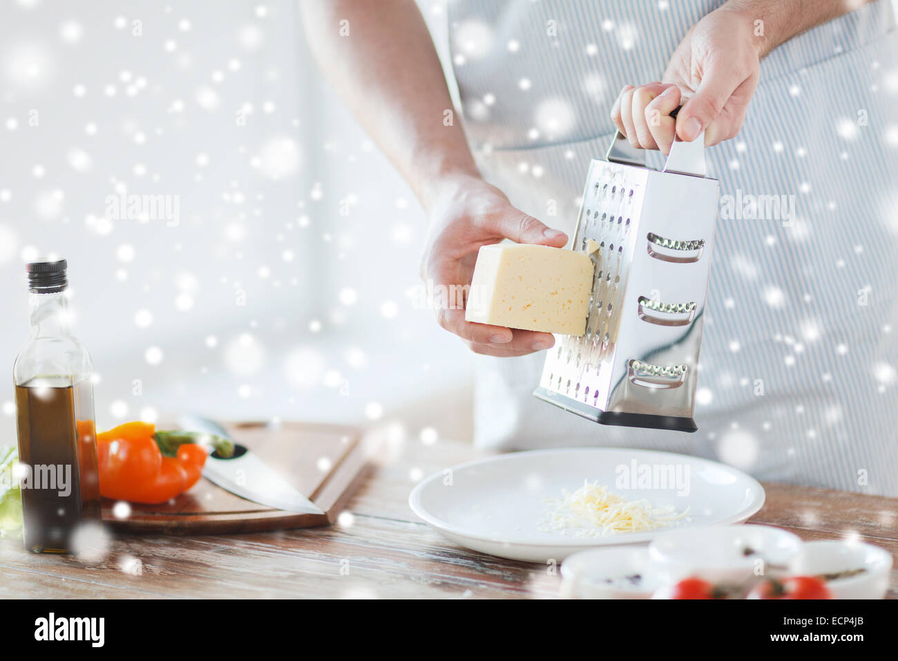 close up of male hands with grater grating cheese Stock Photo - Alamy