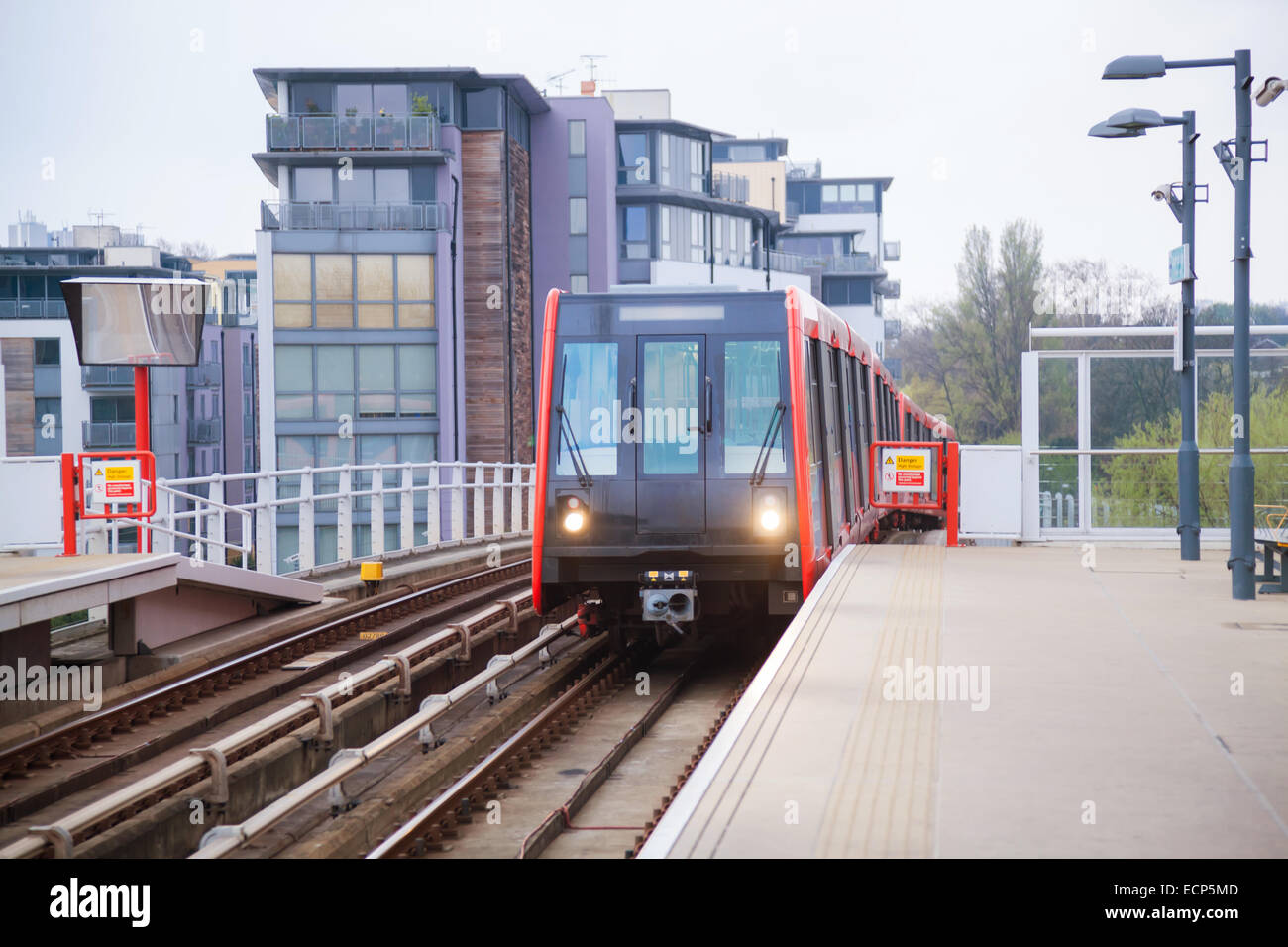 Red Train metro approaching to Station London England UK Stock Photo ...