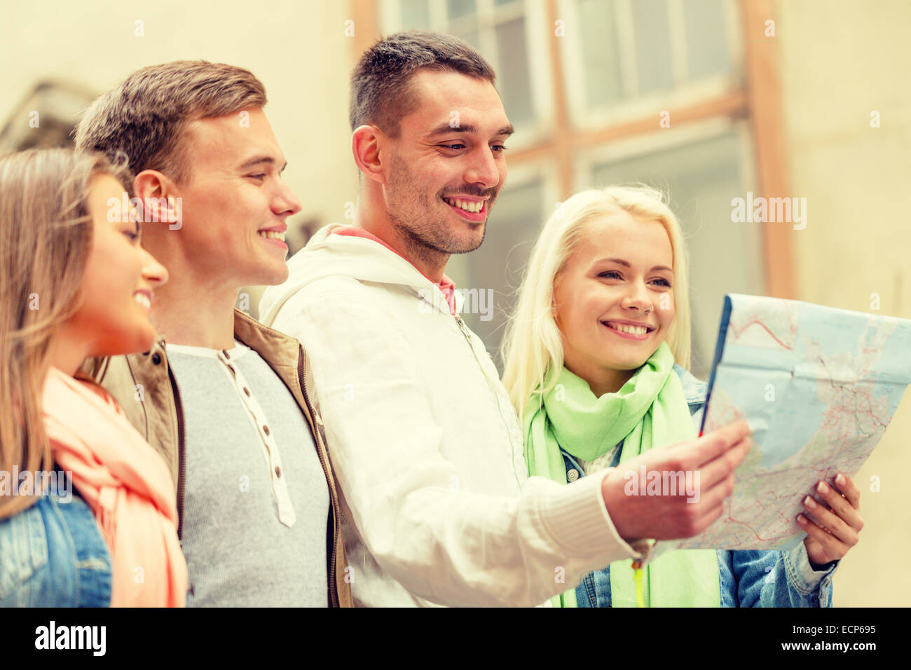 group of friends with map exploring city Stock Photo - Alamy