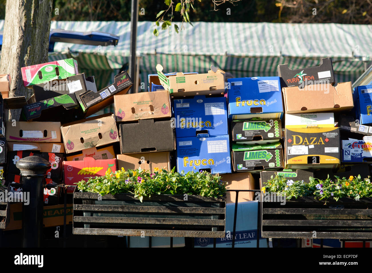 Cardboard fruit and vegetable boxes stacked at market stall Stock Photo ...