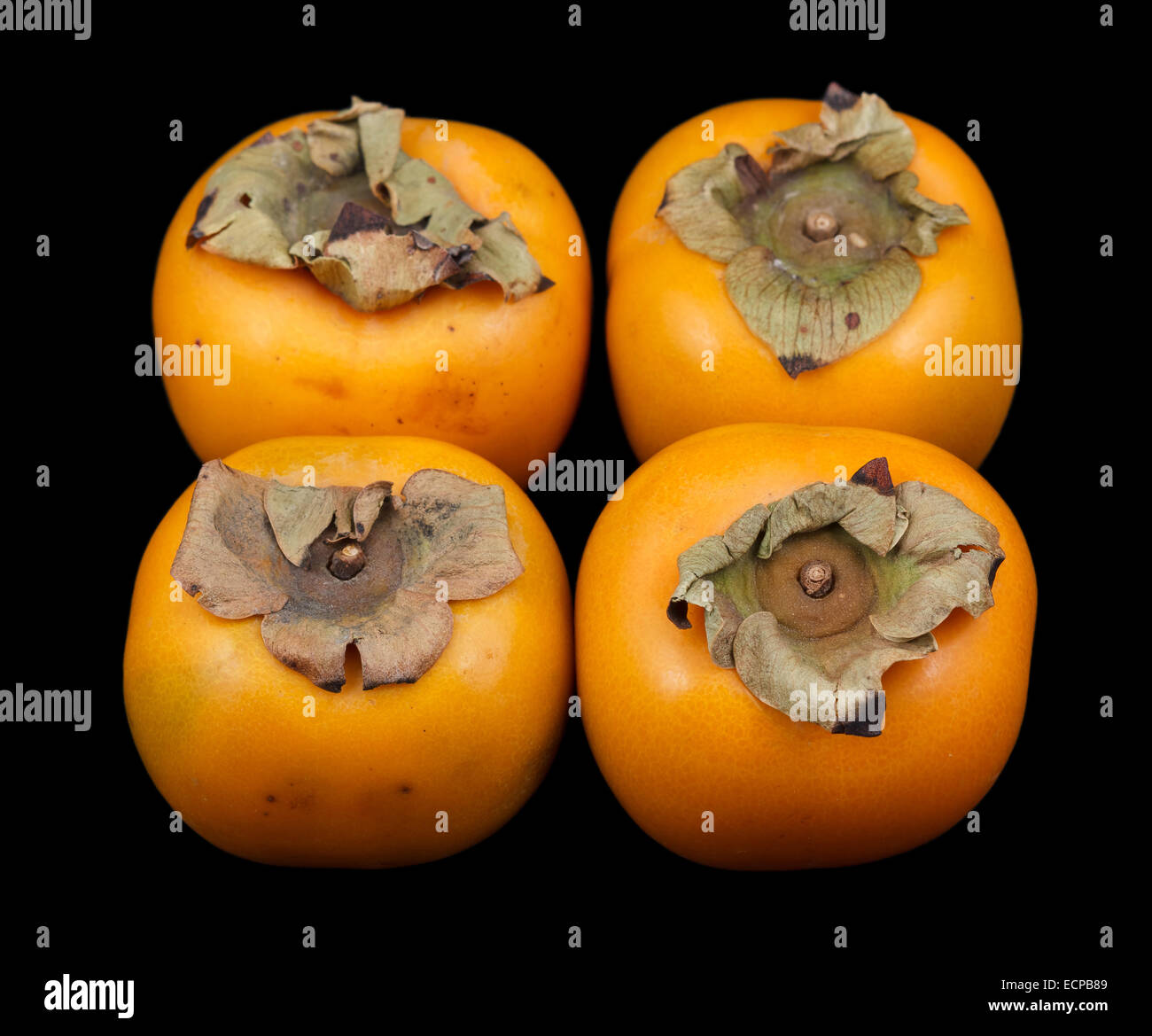 Four persimmon fruits Stock Photo - Alamy