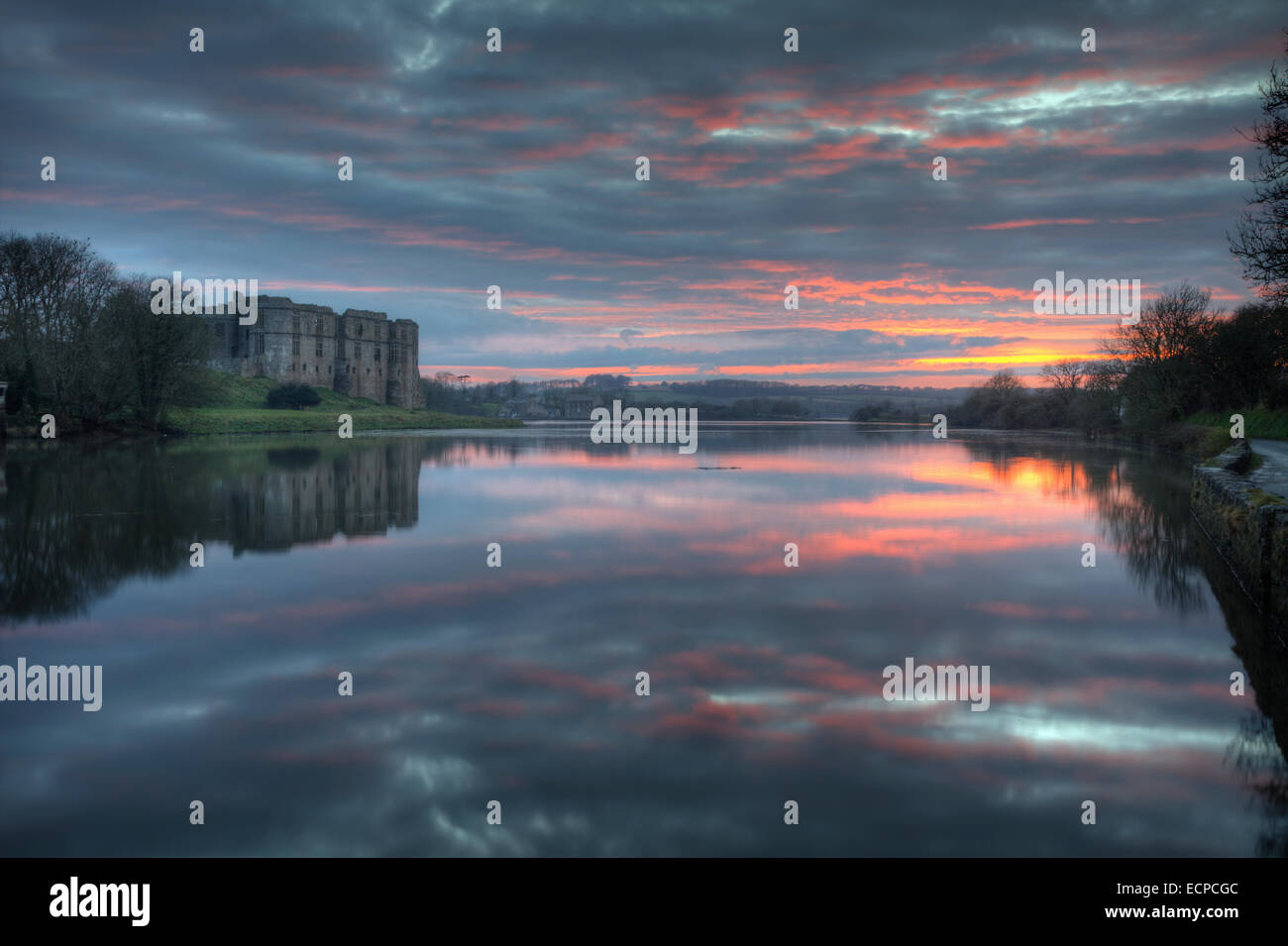 Carew Castle captured at sunset Stock Photo - Alamy