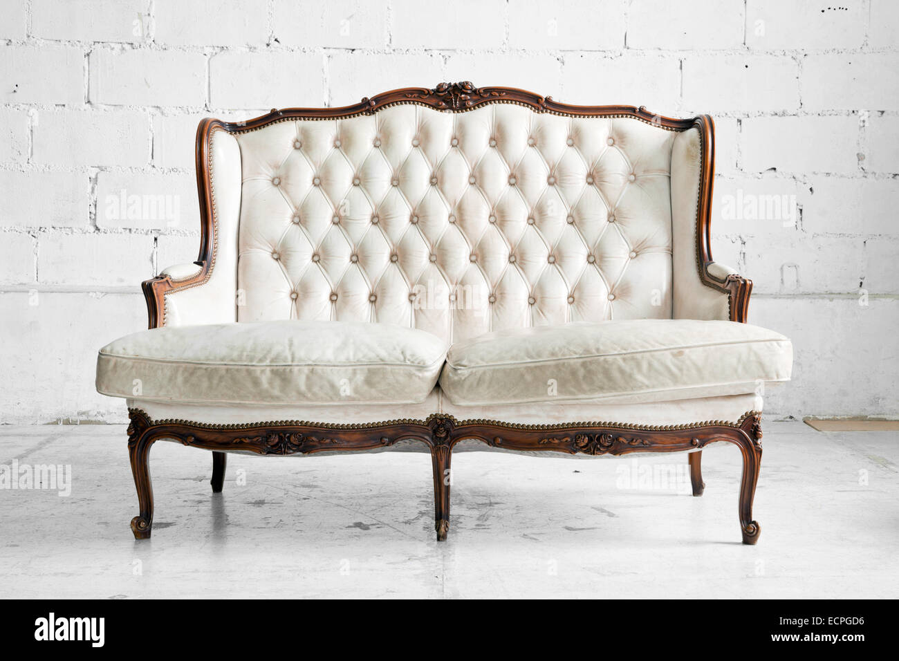 White genuine leather classical style sofa in vintage room Stock Photo ...