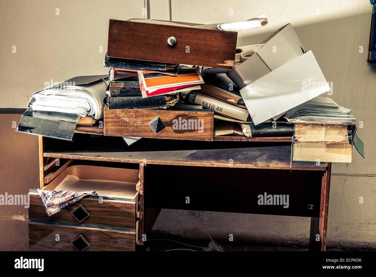 Messy workplace with stack of old paper Stock Photo - Alamy