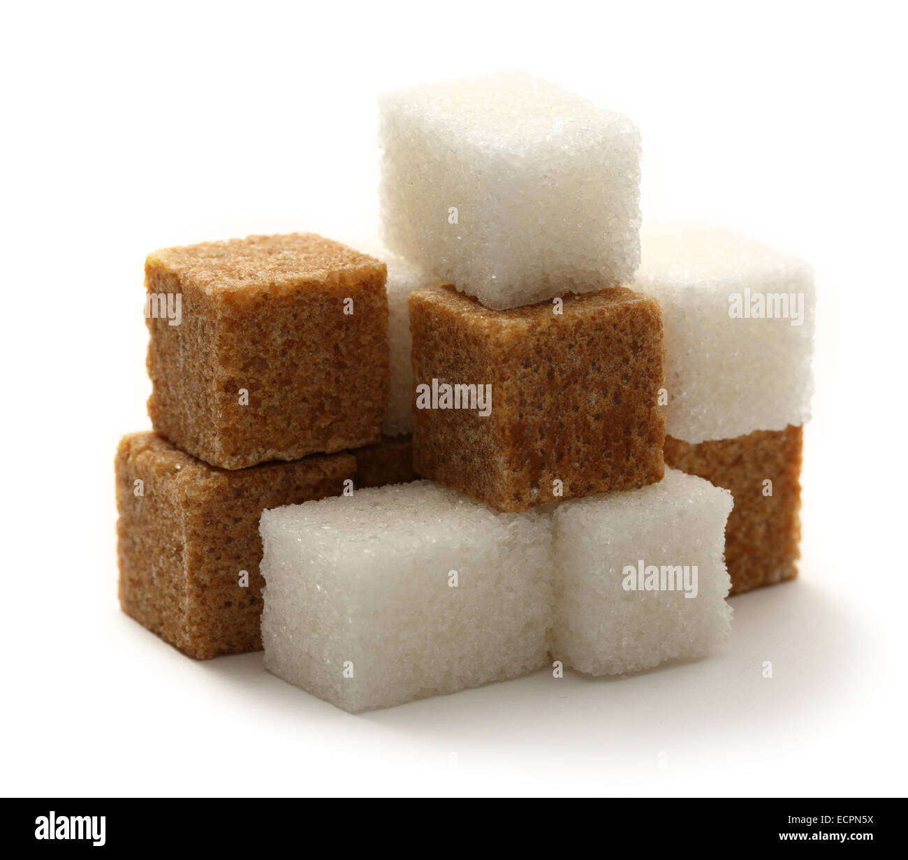 Cane and white sugar cubes on white Stock Photo - Alamy