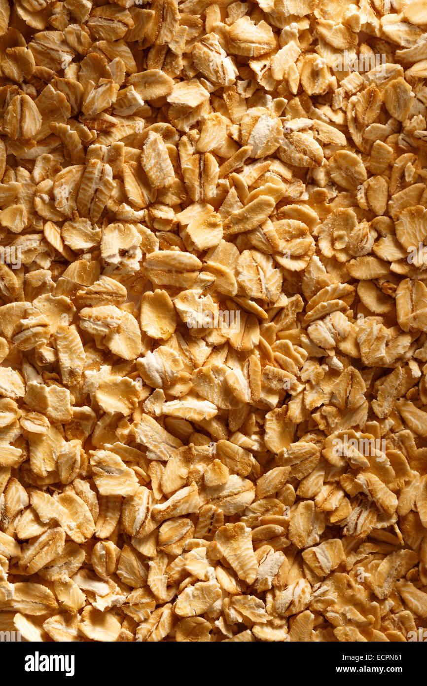 Dry oats cereal as background in closeup Stock Photo - Alamy