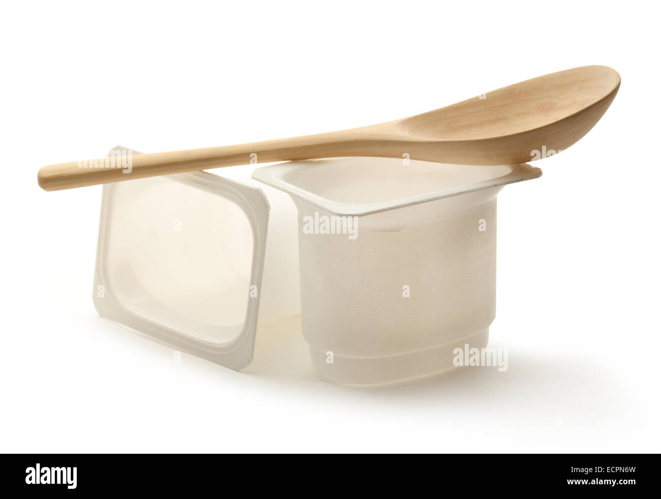 Empty plastic yogurt pots with wooden spoon Stock Photo - Alamy