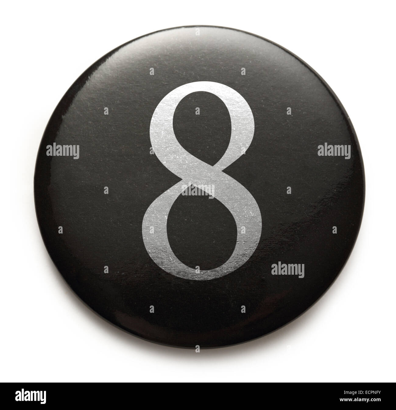 White number 8 on black round badge Stock Photo - Alamy