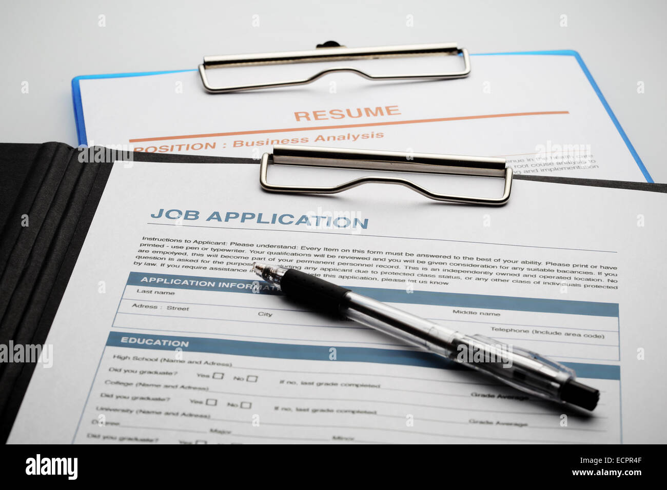 Apply for new job by Application and Resume Document Stock Photo - Alamy