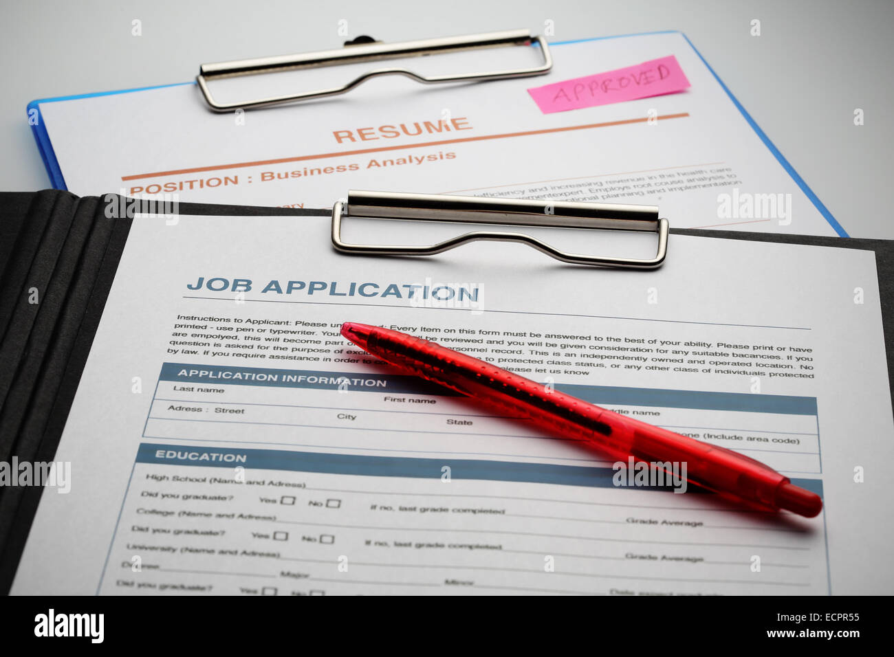 Apply for new job by Application and Resume Document Stock Photo - Alamy