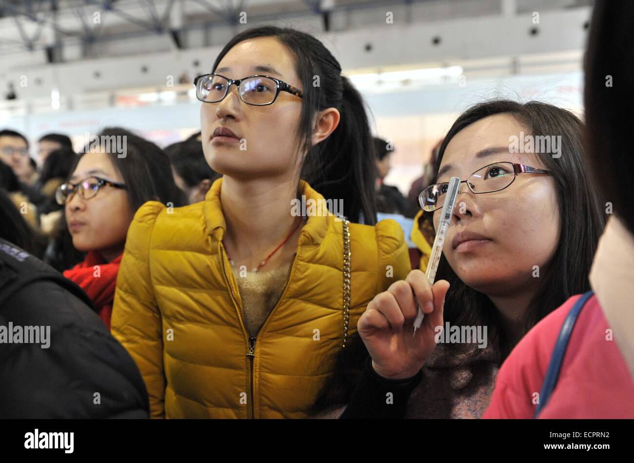 Beijing, China. 18th Dec, 2014. Job seekers look at employment ...