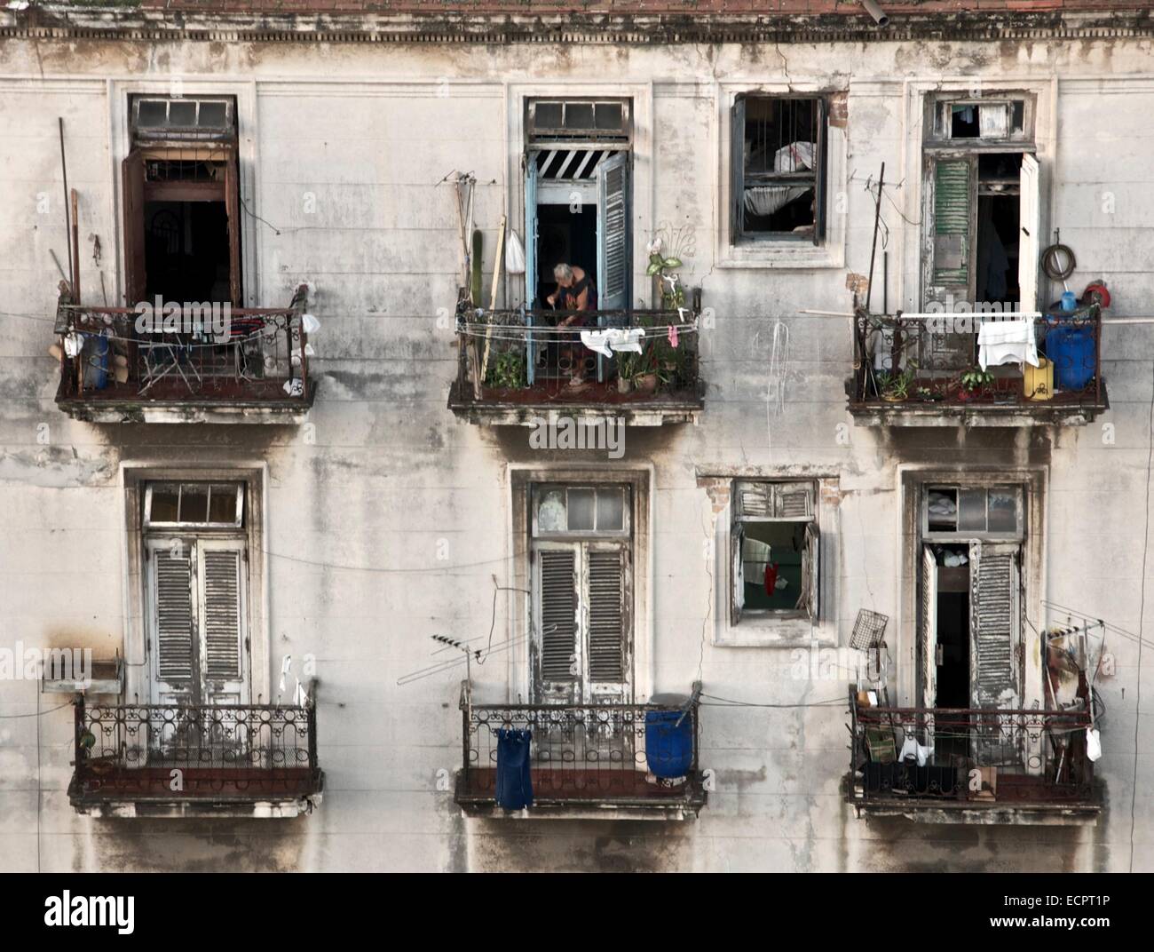 A cuban woman cleans the balcony of her apartment in Havana, Cuba Stock ...