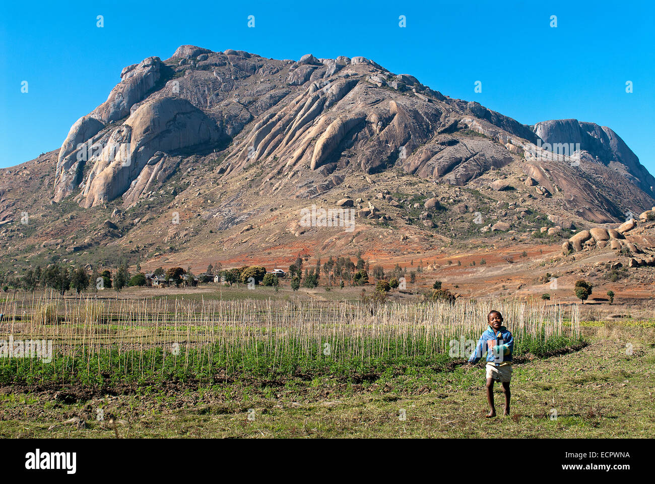 A Small boy running in Madagascar Stock Photo - Alamy