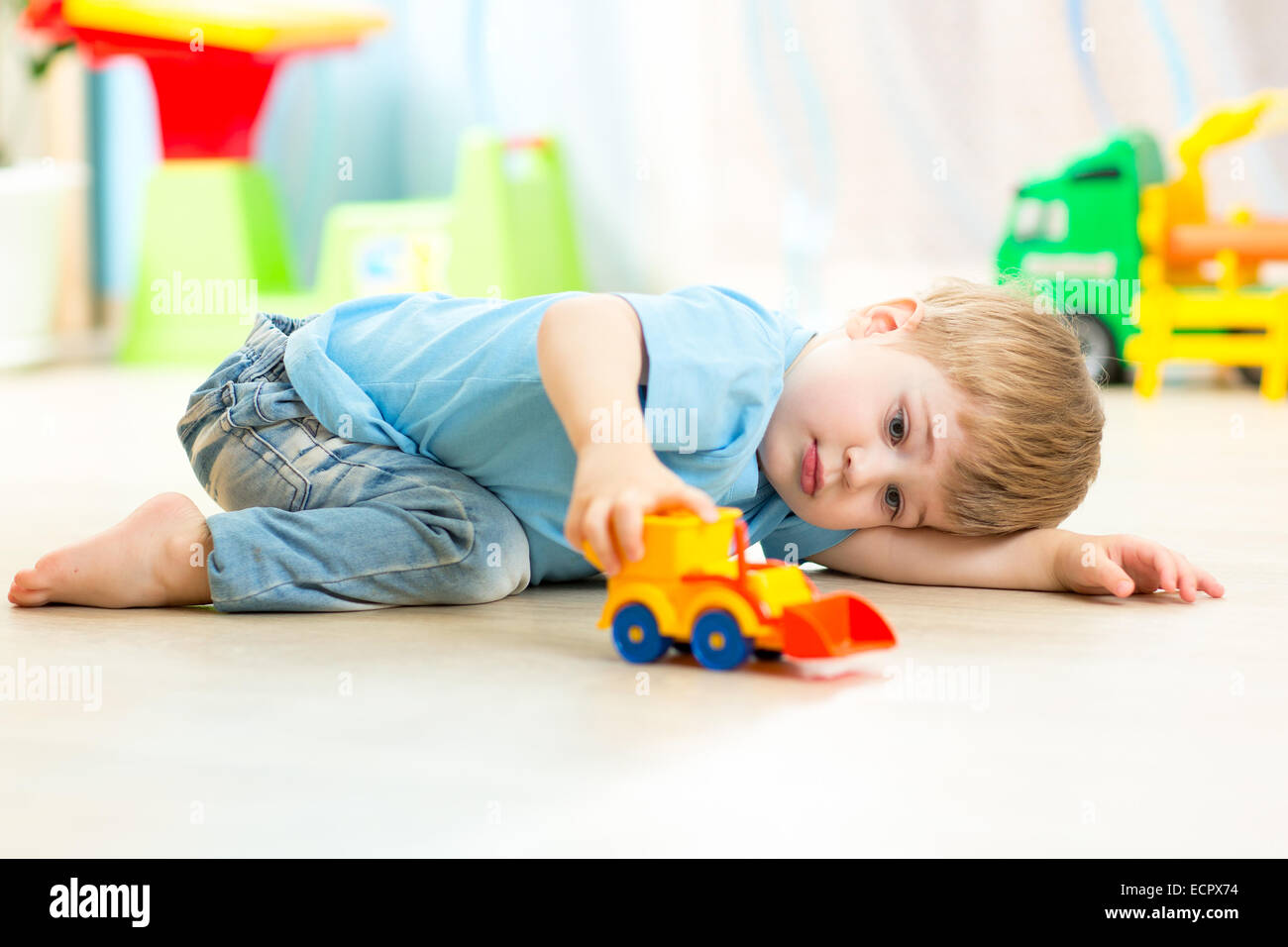 child boy toddler playing with toy car Stock Photo - Alamy