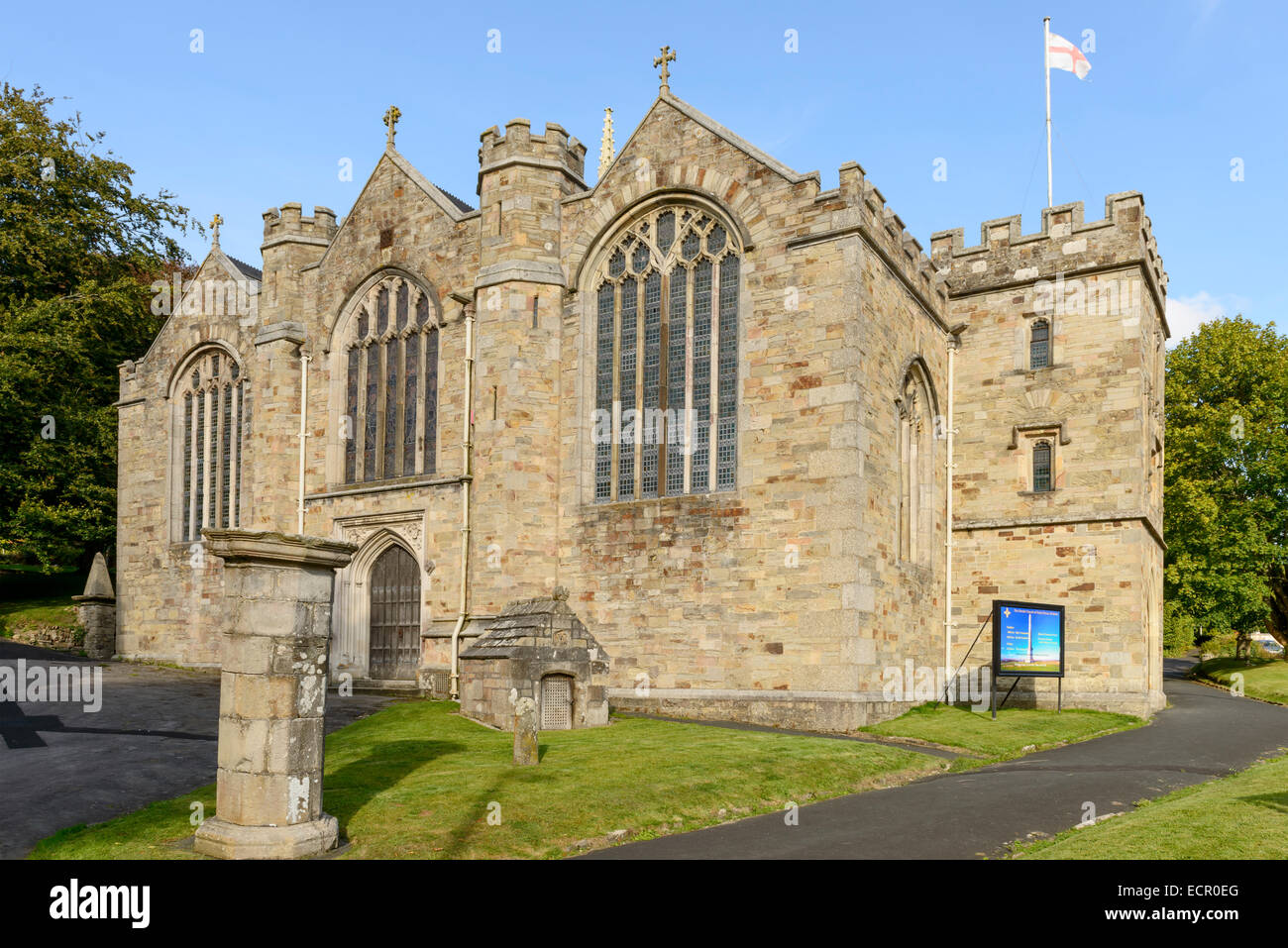 view of ancient stone church in small town in Cornwall countryside ...
