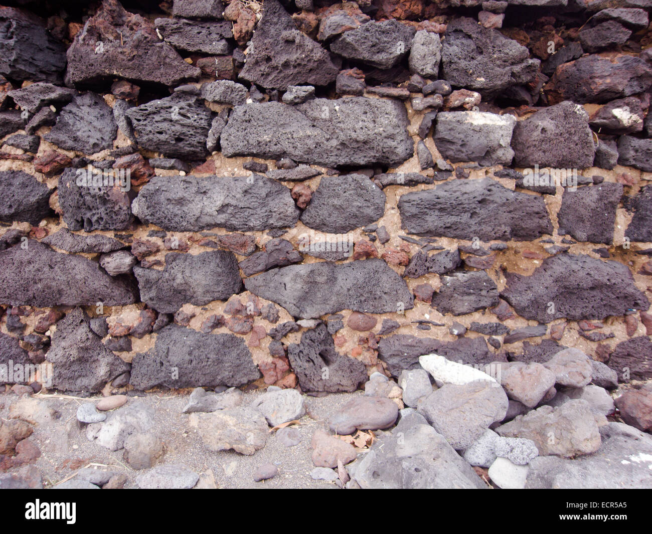 A lot of rocks doing a ruin wall Stock Photo - Alamy