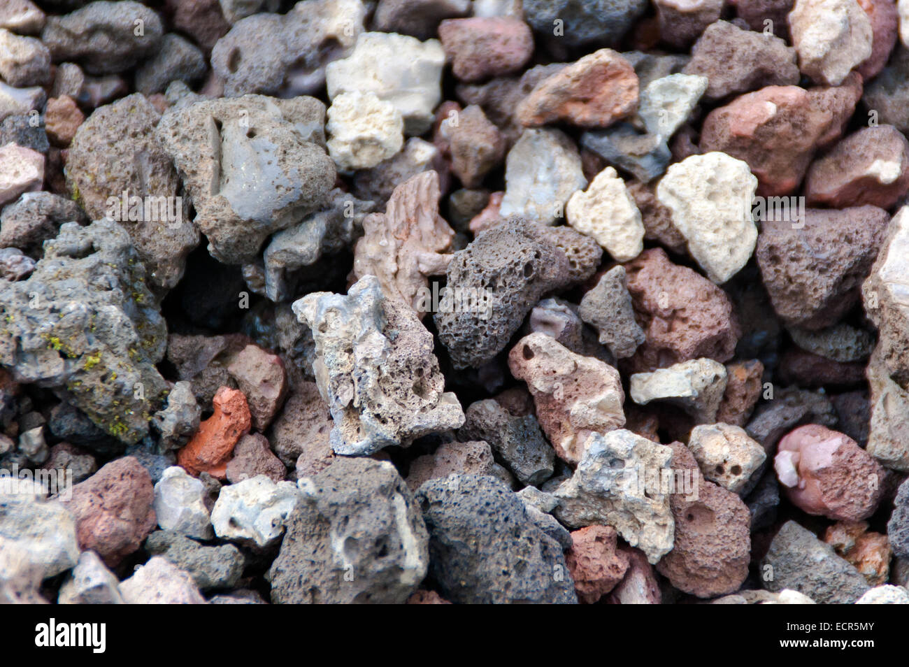 A lot of volcanic rocks of differents sizes and colors Stock Photo - Alamy