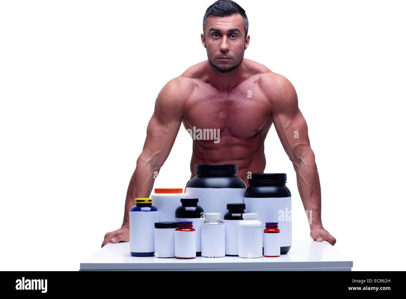 Portrait of a muscular man presenting sports nutrition Stock Photo - Alamy