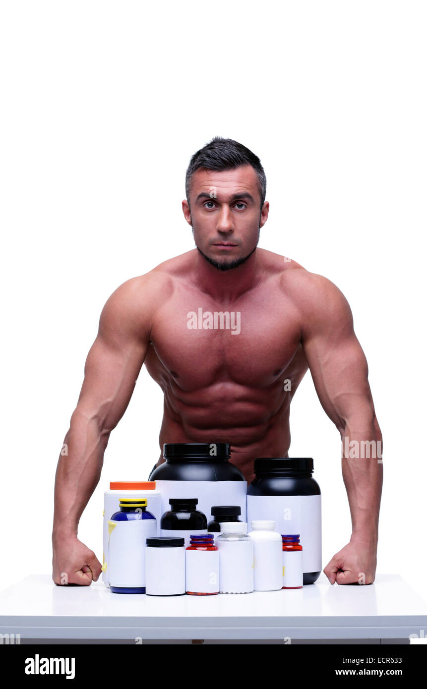 Portrait of a serious muscular man with sports nutrtion Stock Photo - Alamy