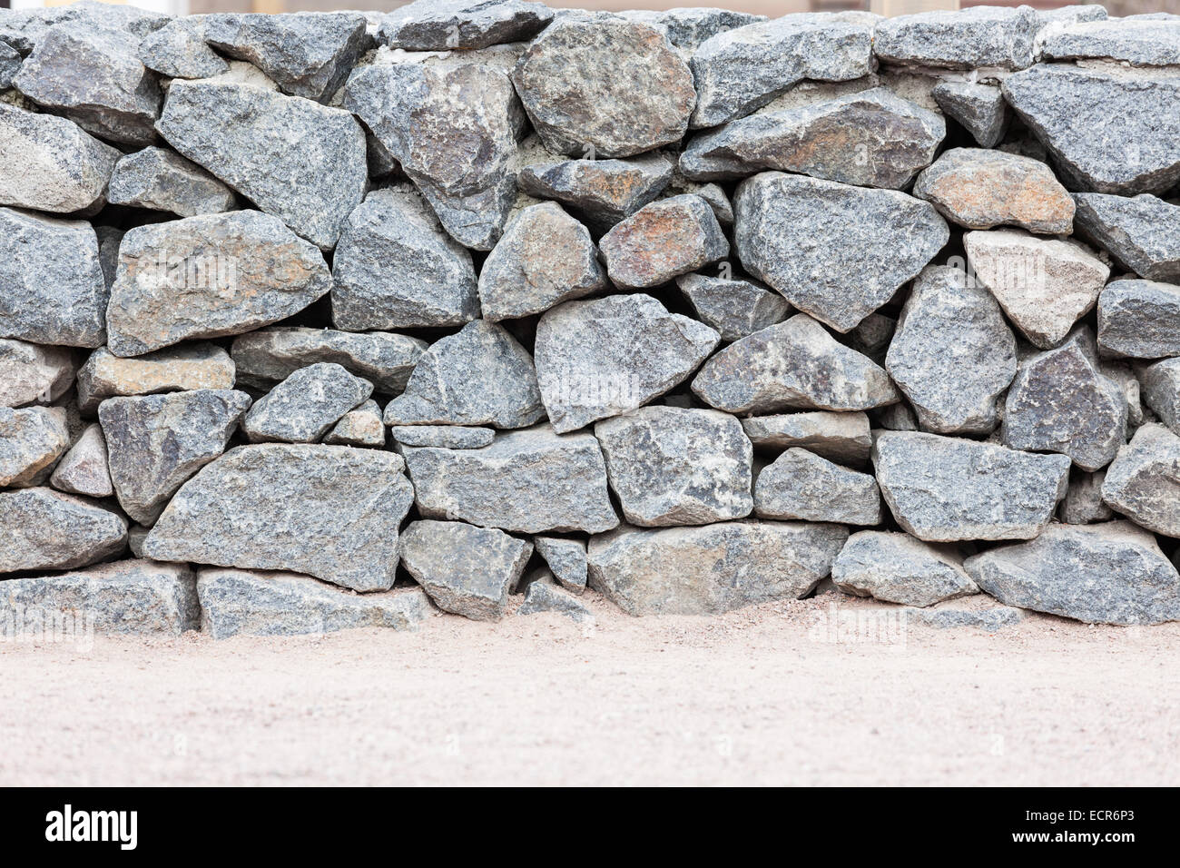 Old stone wall made of big rocks Stock Photo - Alamy