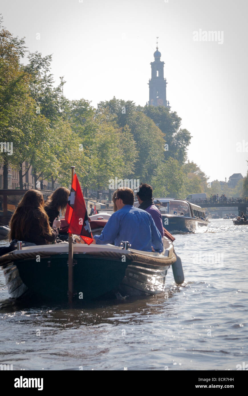 A small boat travelling along the prinsengracht in Amsterdam Stock ...