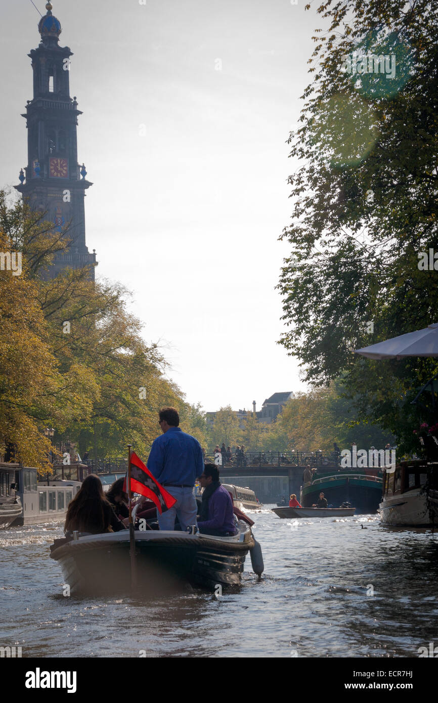 A small boat travelling along the prinsengracht in Amsterdam Stock ...