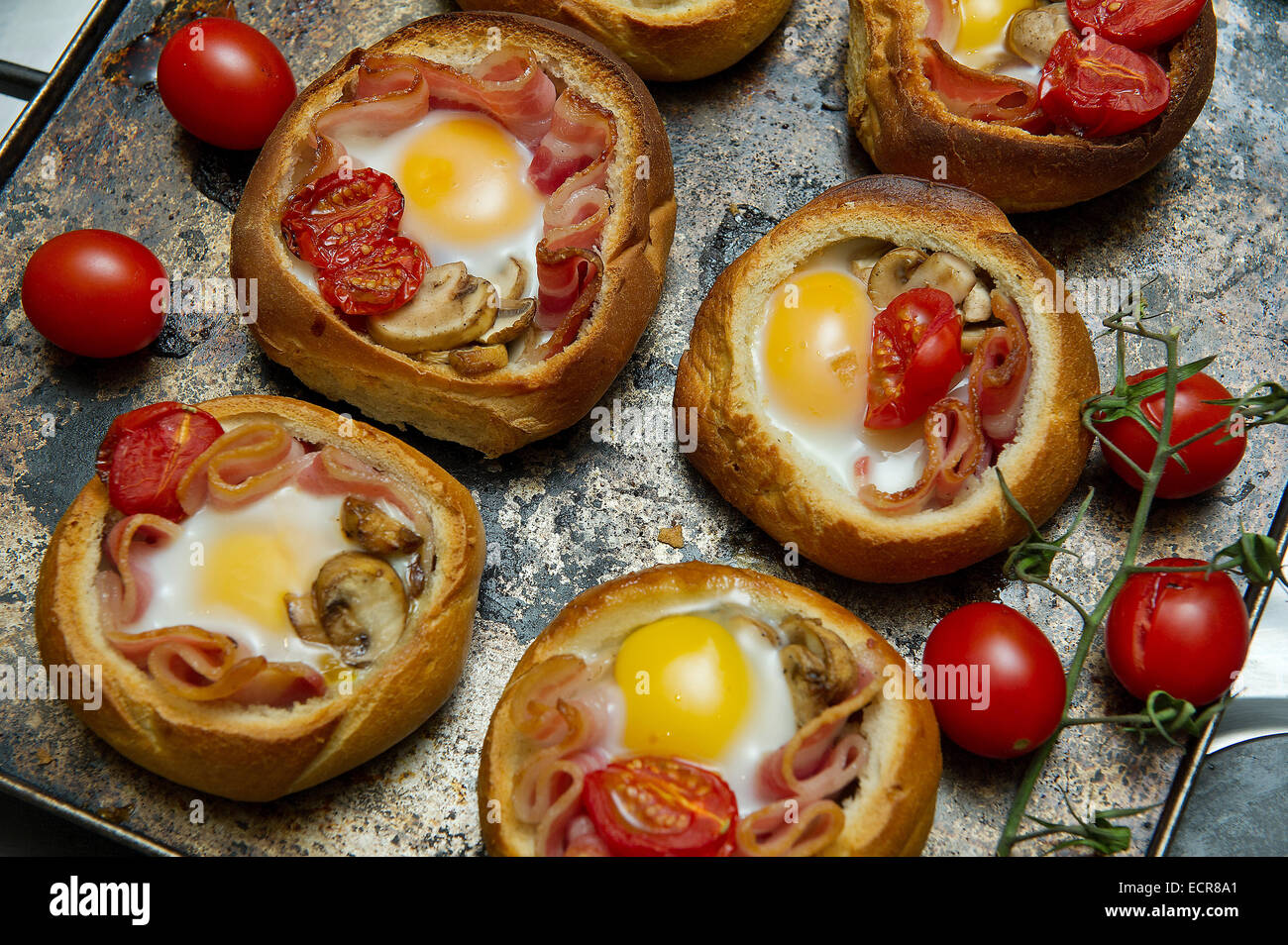 Breakfast baps/rolls with eggs, bacon, mushrooms and tomato Stock Photo ...