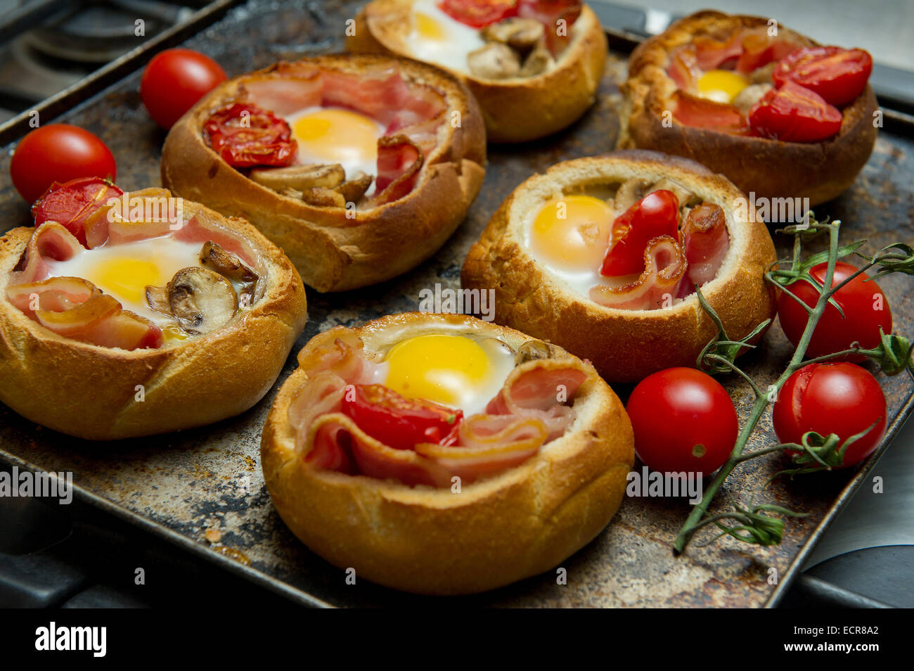 Breakfast baps/rolls with eggs, bacon, mushrooms and tomato Stock Photo ...