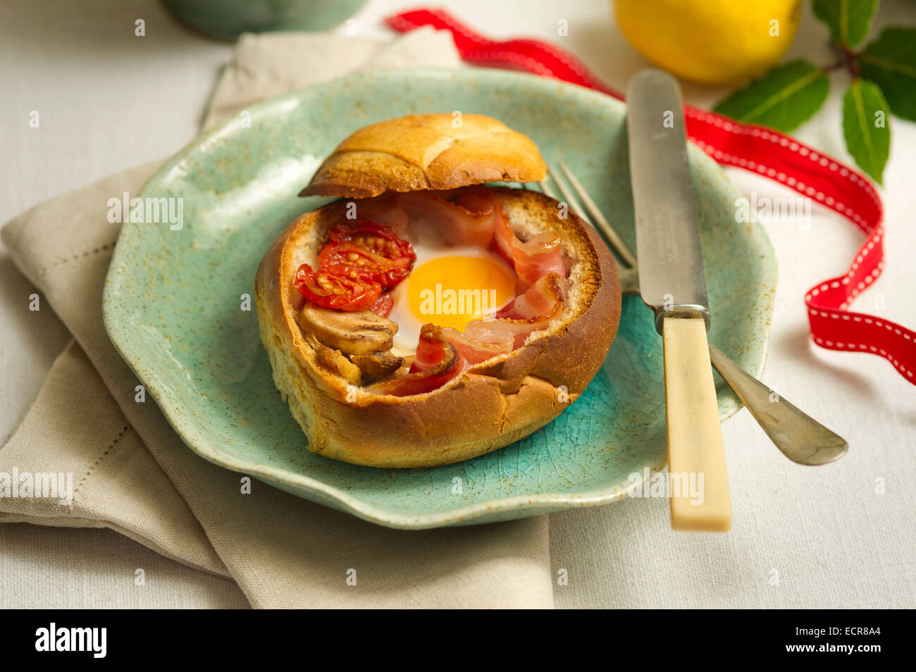 Breakfast baps/rolls with eggs, bacon, mushrooms and tomato Stock Photo ...